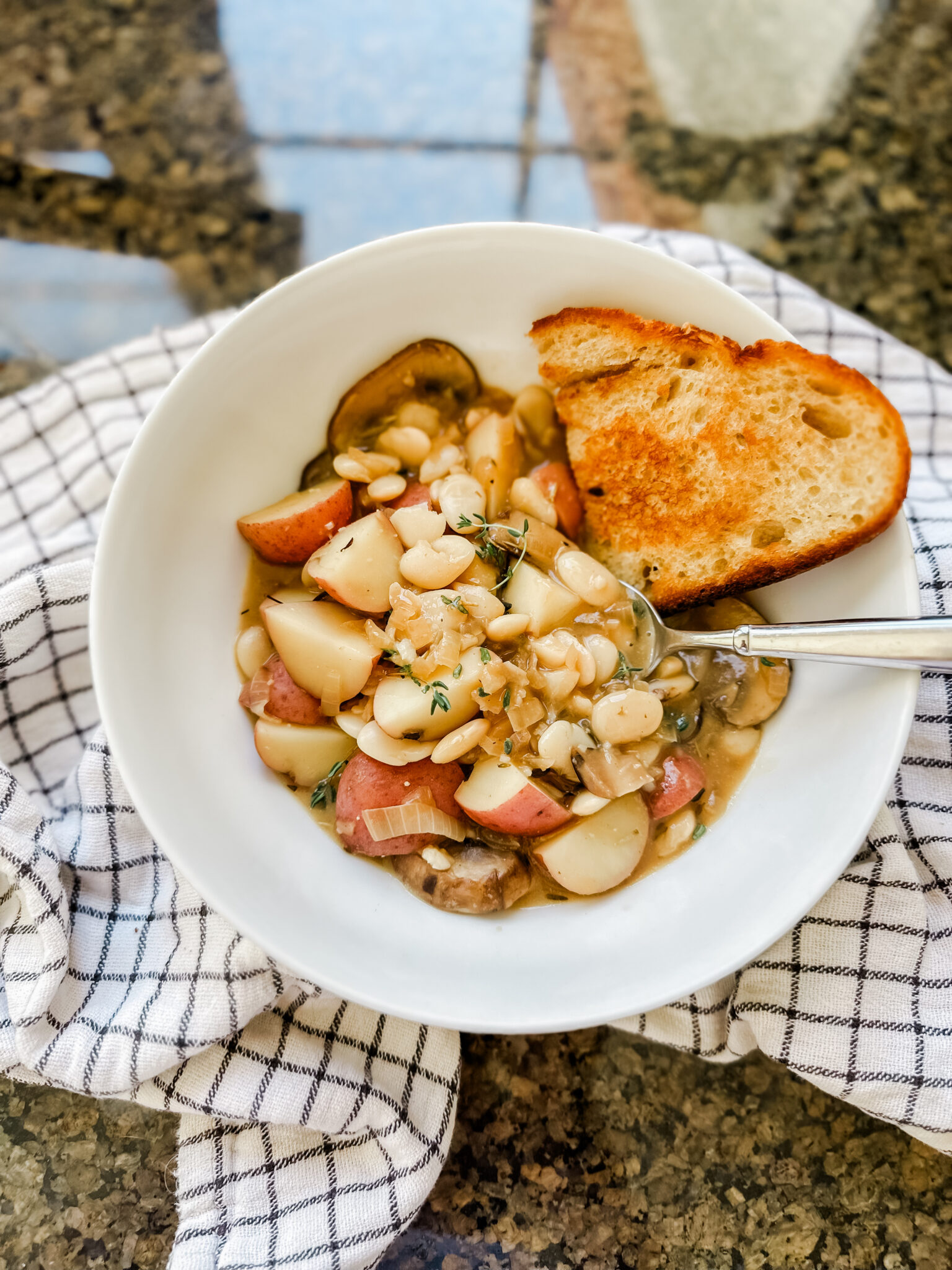 Spring's Warm Embrace: Creamy Mushroom and White Bean Stew